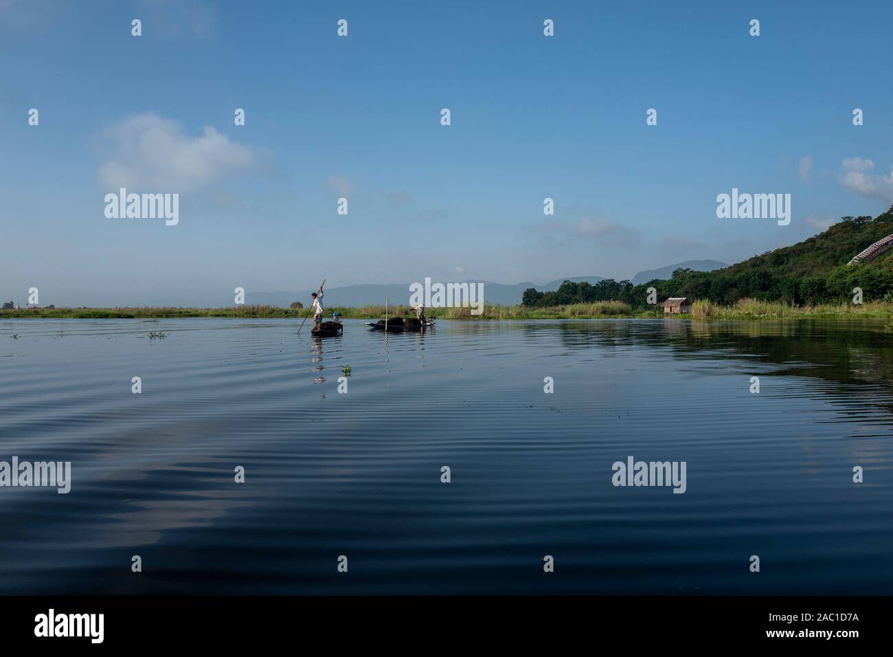 Traditional fisherman on Inle Lake in Myanmar at sunset Stock Photo - Alamy