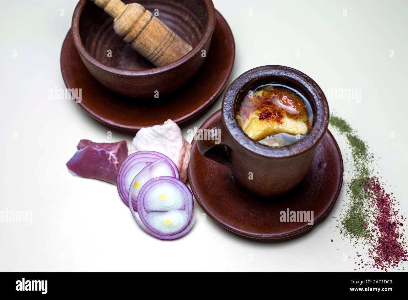 bozbash in piti ceramic clay pot in white background Stock Photo - Alamy