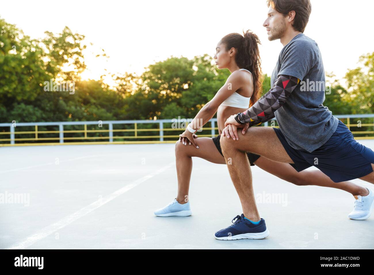 Image of an amazing young strong sports couple man and woman make ...