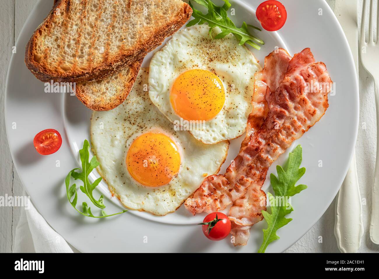 Fresh breakfast with toast, eggs and bacon Stock Photo - Alamy