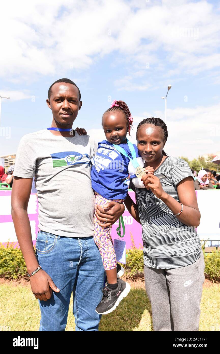 Hellen Obiri (KEN) poses with Tom Nyaundi and daughter Tania Mocheche at the Great Ethiopian Run ...