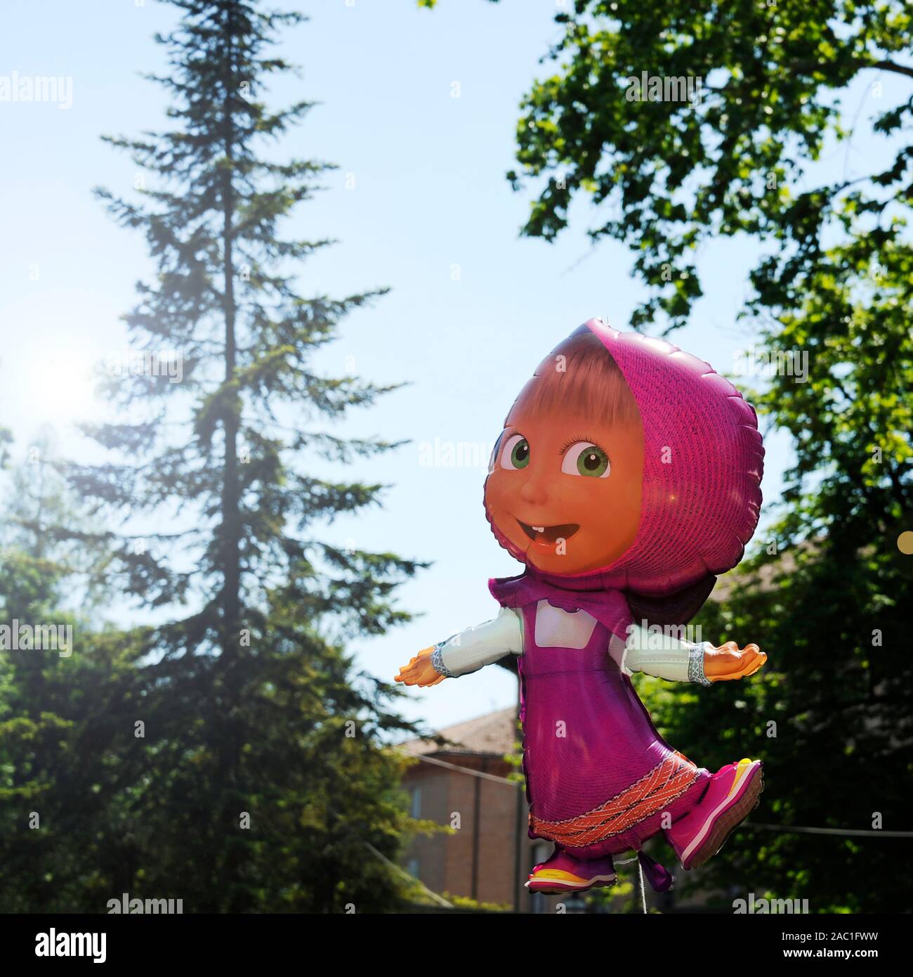 Balloon of Masha on the background of a pine trees forest. Childhood ...