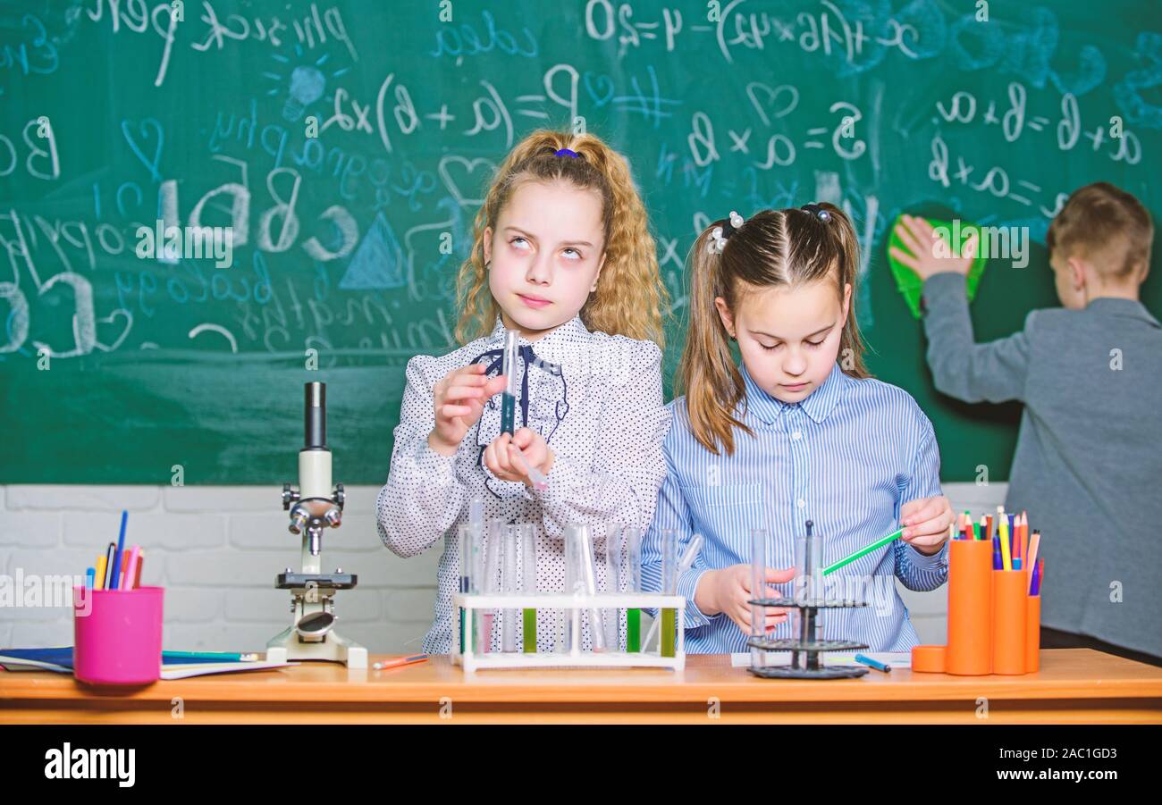 Little girls and boy in lab. Chemistry science. Little kids earning ...