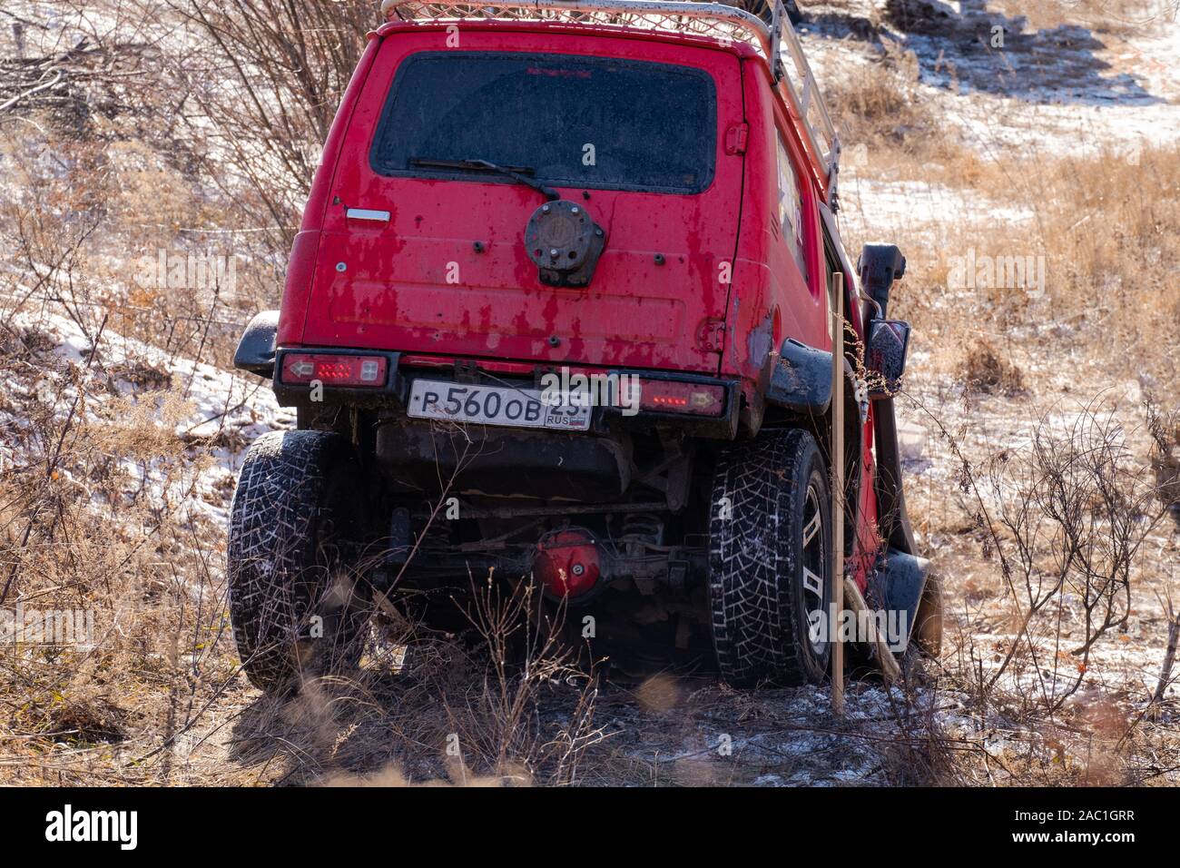 Jeep Suzuki Jimny overcomes obstacles in the forest Stock Photo - Alamy