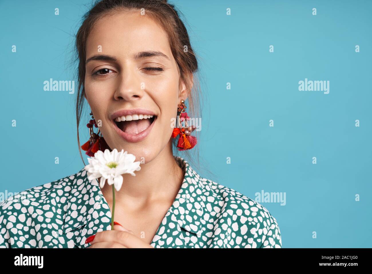 Girl winking close up hi-res stock photography and images - Alamy