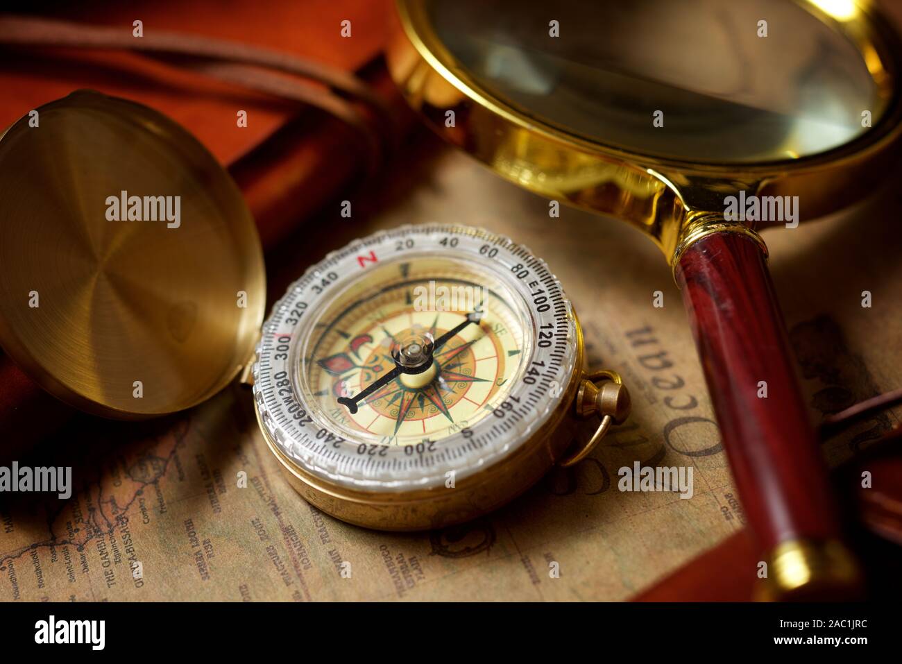 Vintage compass and old navigation map Stock Photo - Alamy