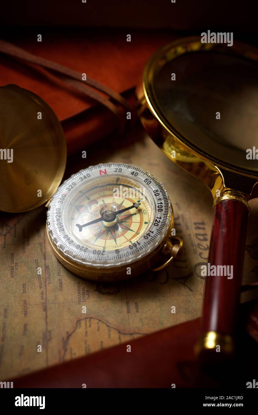 Vintage compass and old navigation map Stock Photo - Alamy
