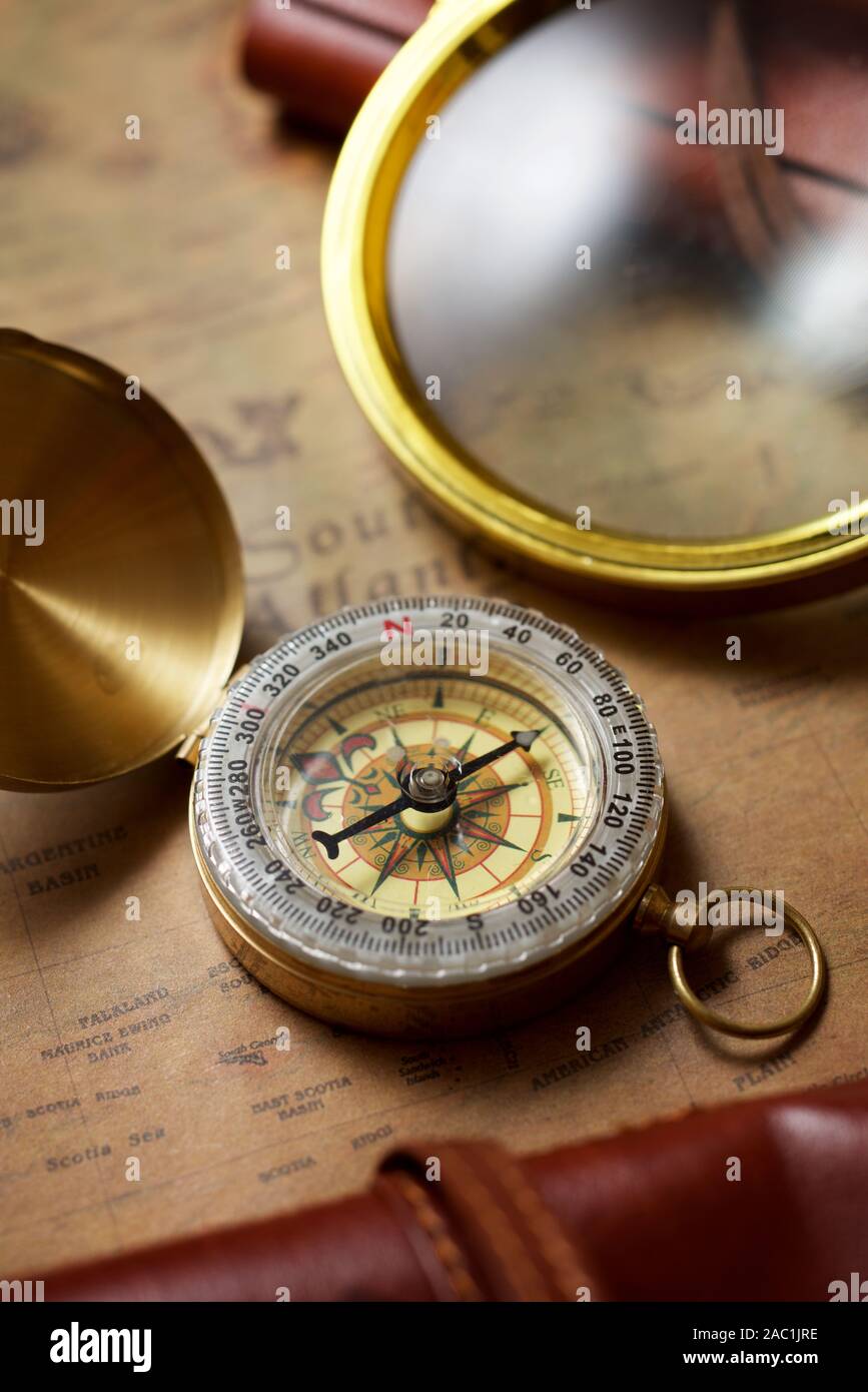 Vintage compass and old navigation map Stock Photo - Alamy