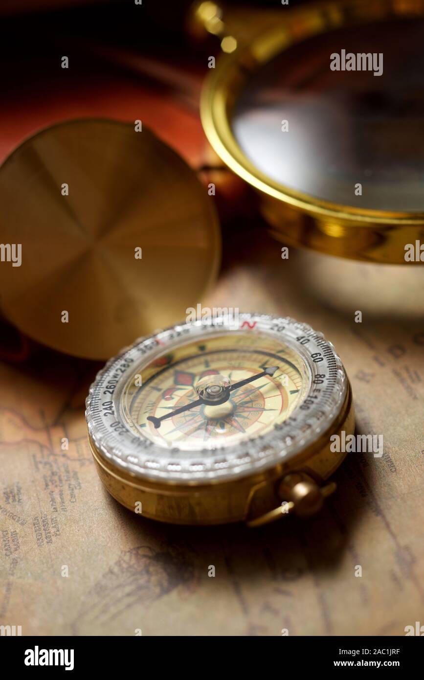 Vintage compass and old navigation map Stock Photo - Alamy