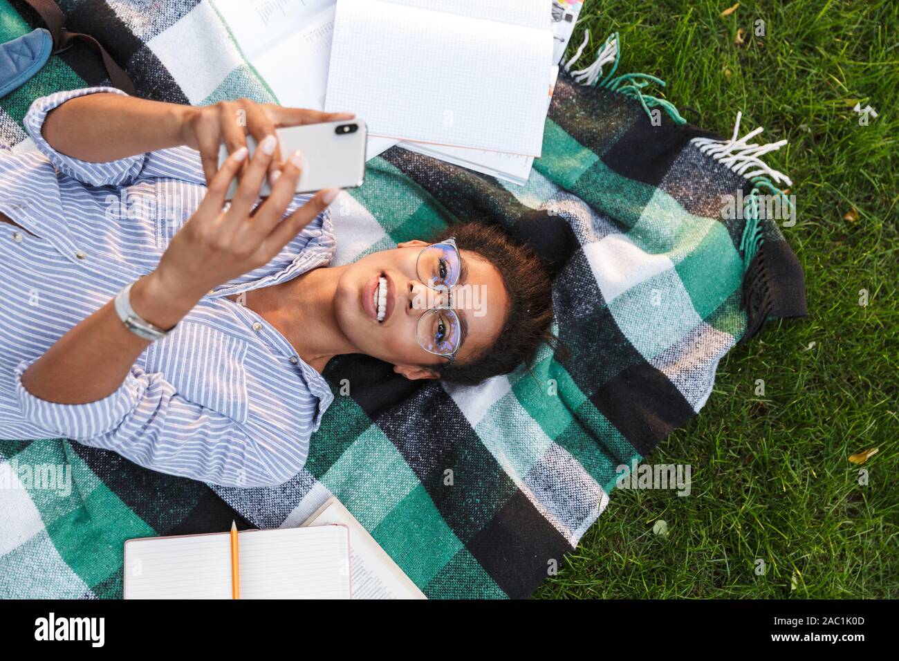 Top view of an attractive young african woman wearing casual outfit ...