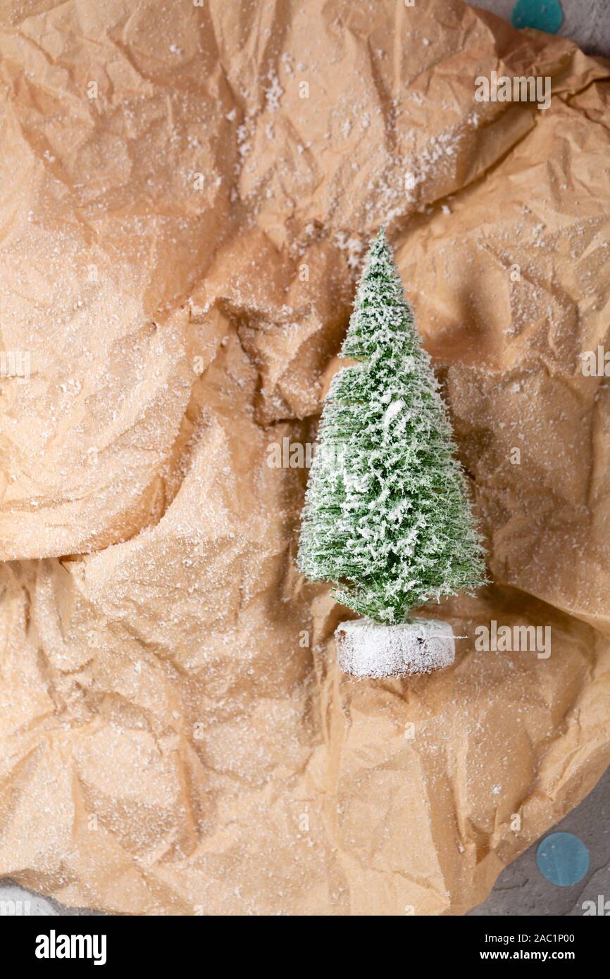 Christmas tree on snow craft paper Stock Photo - Alamy