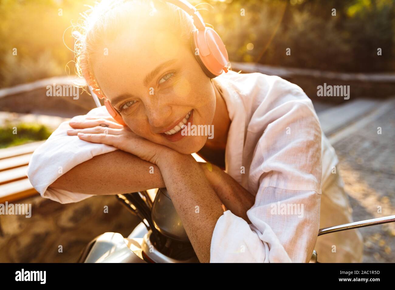 Close up of a beautiful smiling young girl wearing casual summer ...