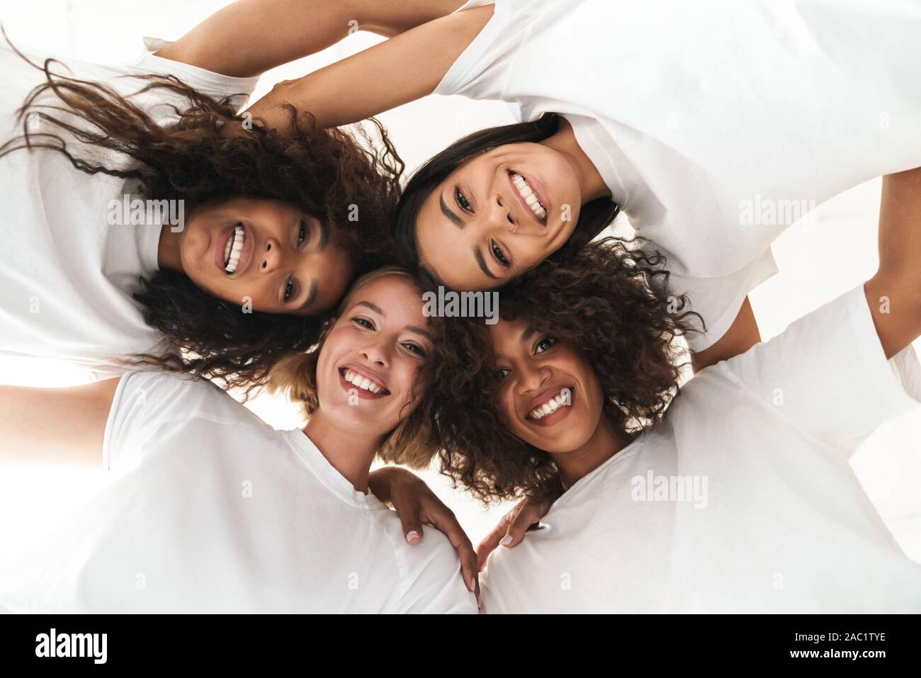 Image of a happy young women multiracial friends posing isolated over ...