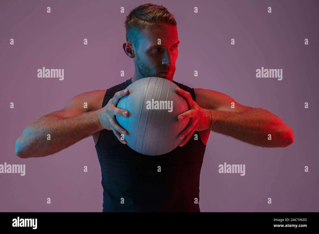 Image of a handsome concentrated young sports man posing isolated over ...