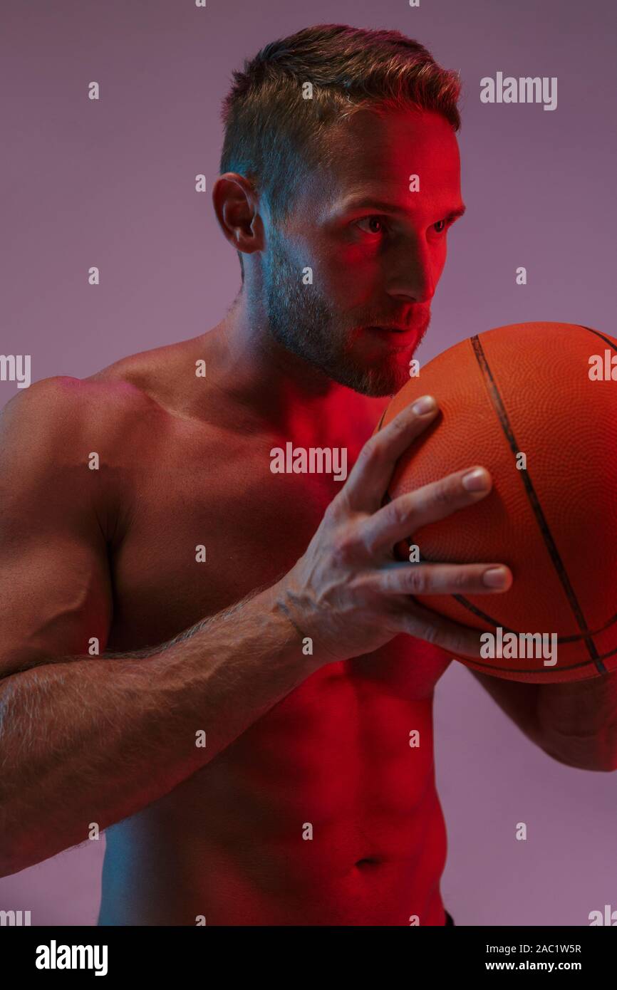 Image of a handsome concentrated young sports man posing isolated over ...