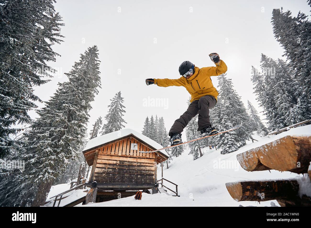 Snowboarder free rider jumping from a snow ramp Stock Photo - Alamy