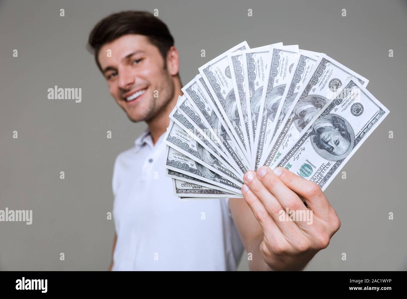 Image of a young happy positive optimistic man posing isolated over ...