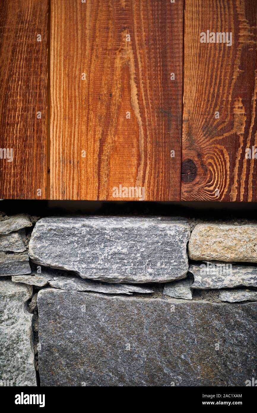 walls with stone and half of wooden slats background Stock Photo - Alamy