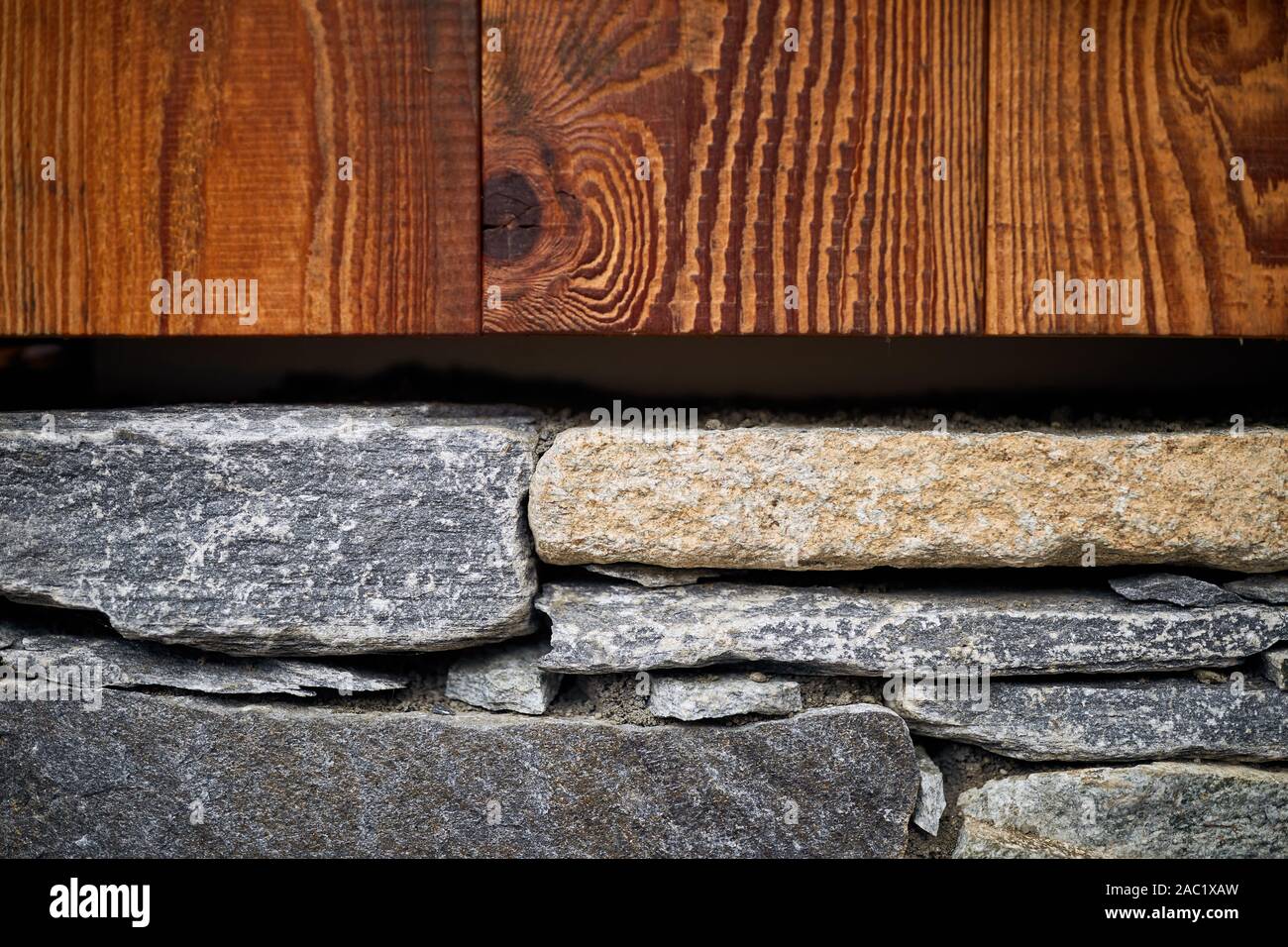 Decorative walls with stone and half of wooden slats background Stock ...