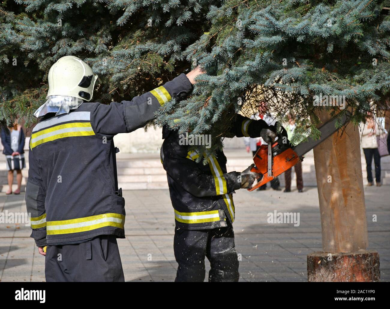 Firefighter works with a chainsaw outdoor Stock Photo - Alamy