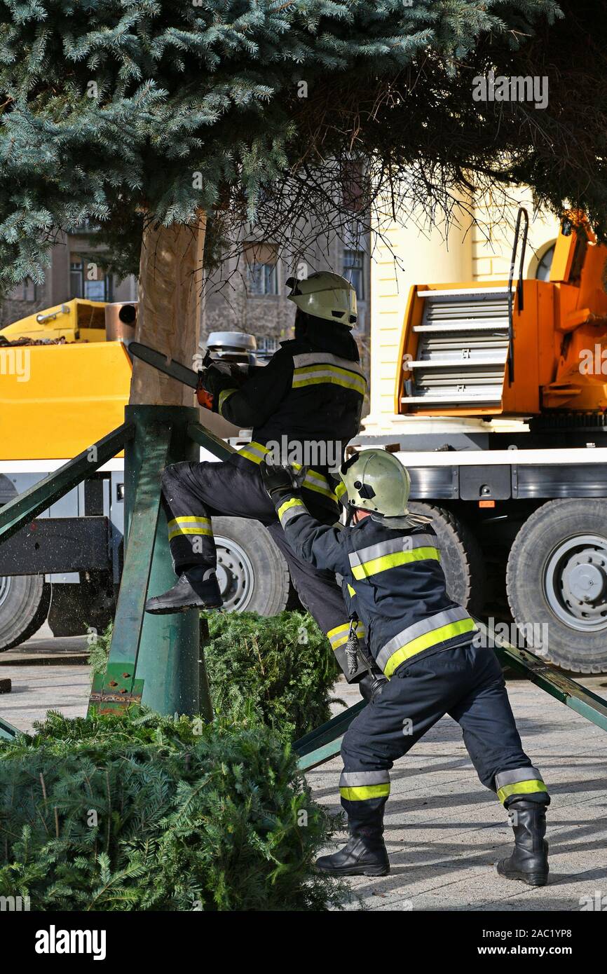 Firefighter works with a chainsaw outdoor Stock Photo - Alamy