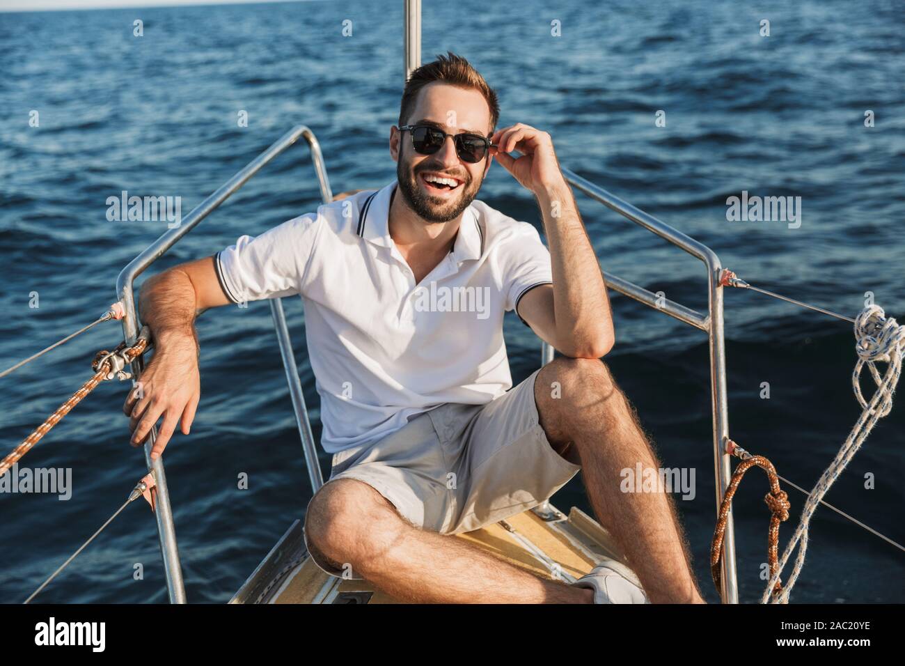 Photo of handsome laughing happy attractive man outdoors posing on ...