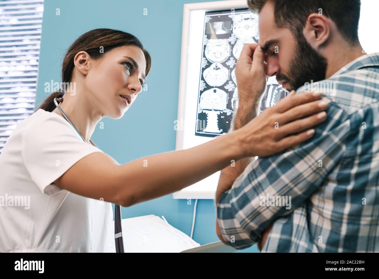 Image of female doctor in medical uniform and frustrated patient man ...