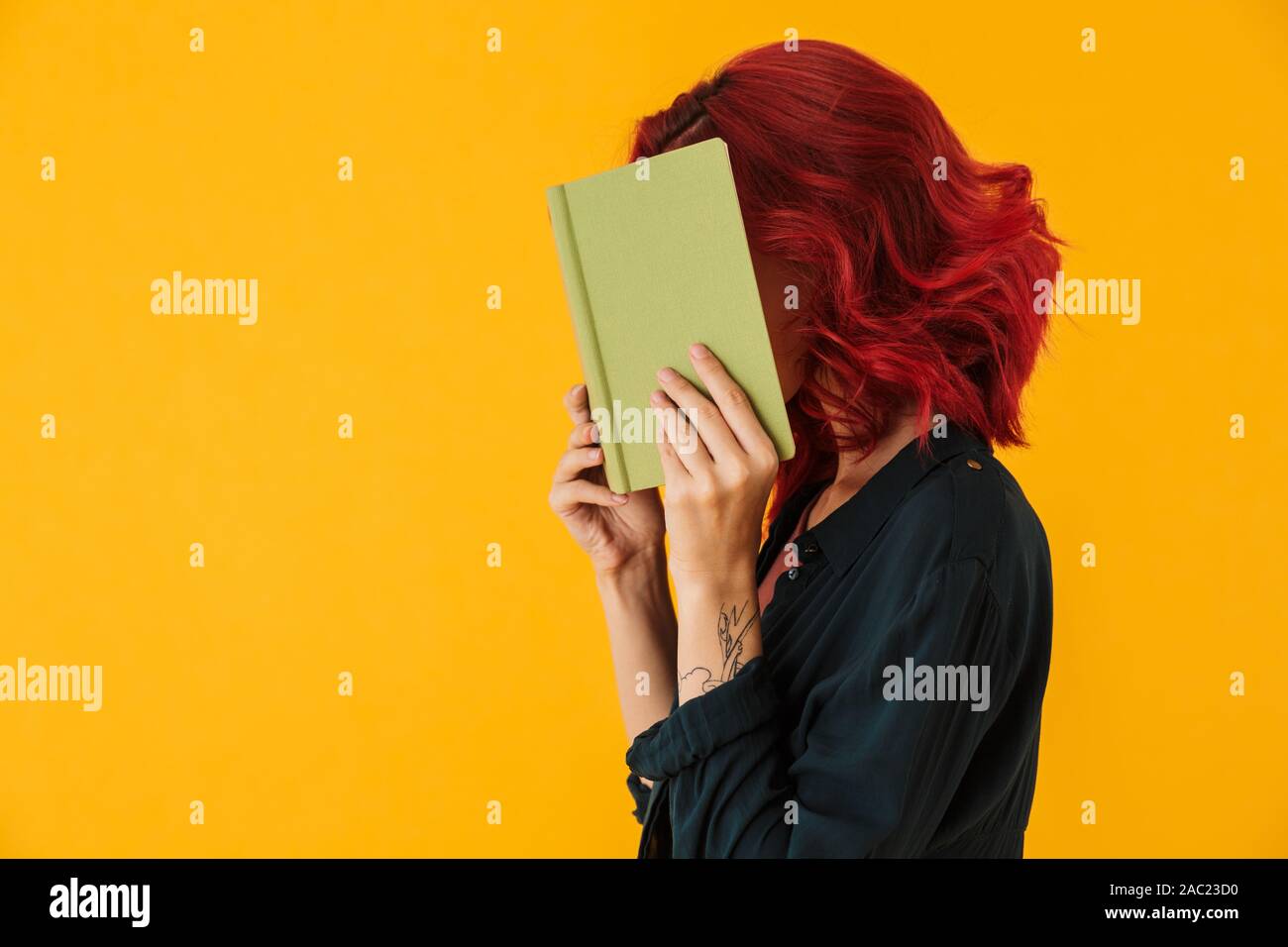 Image of caucasian woman with curly red hair covering her face exercise ...