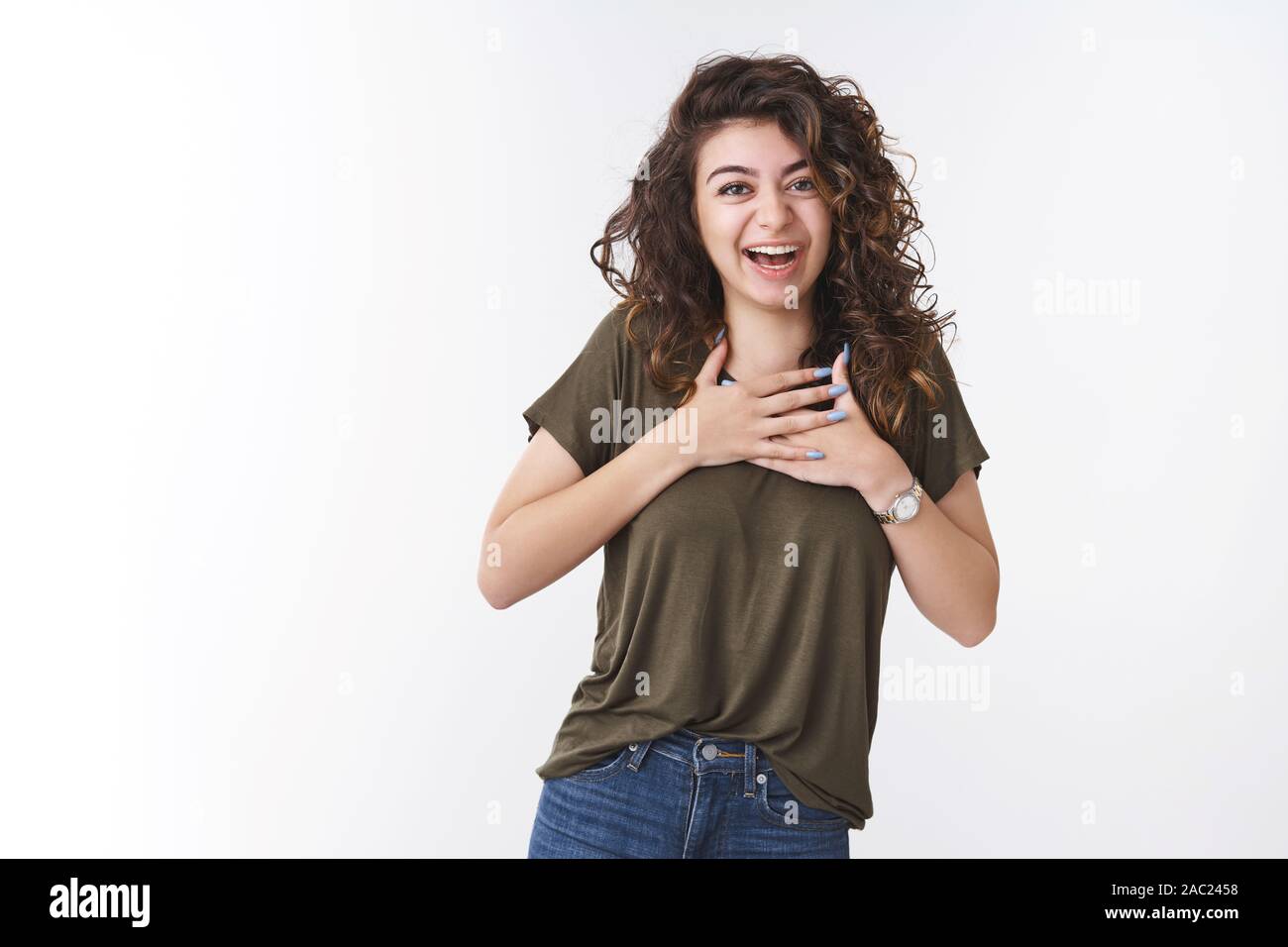 Easy-going delighted touched attractive curly-haired armenian woman ...