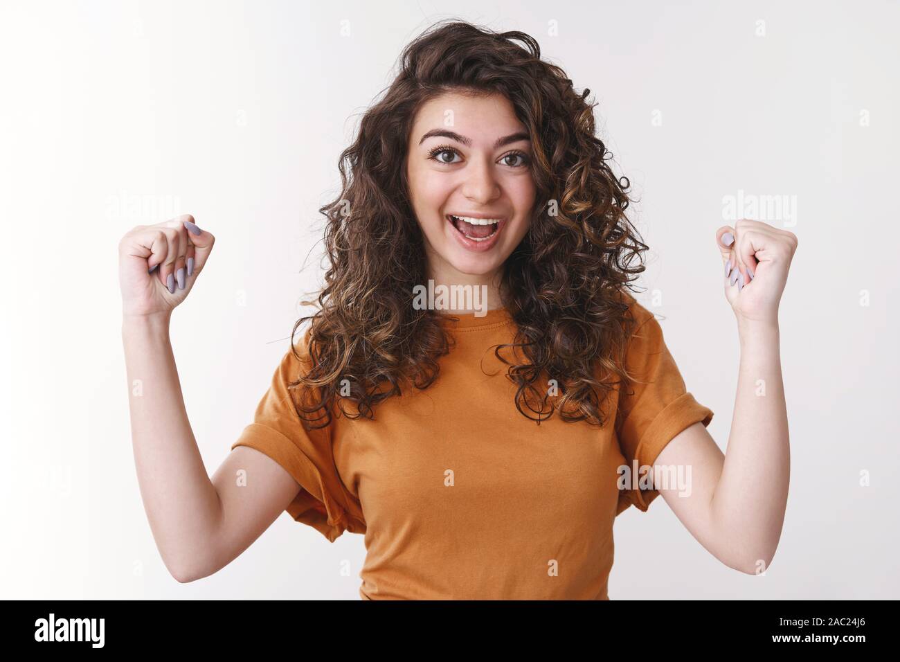 Hooray excellent. Celebrating triumphing happy excited armenian female ...