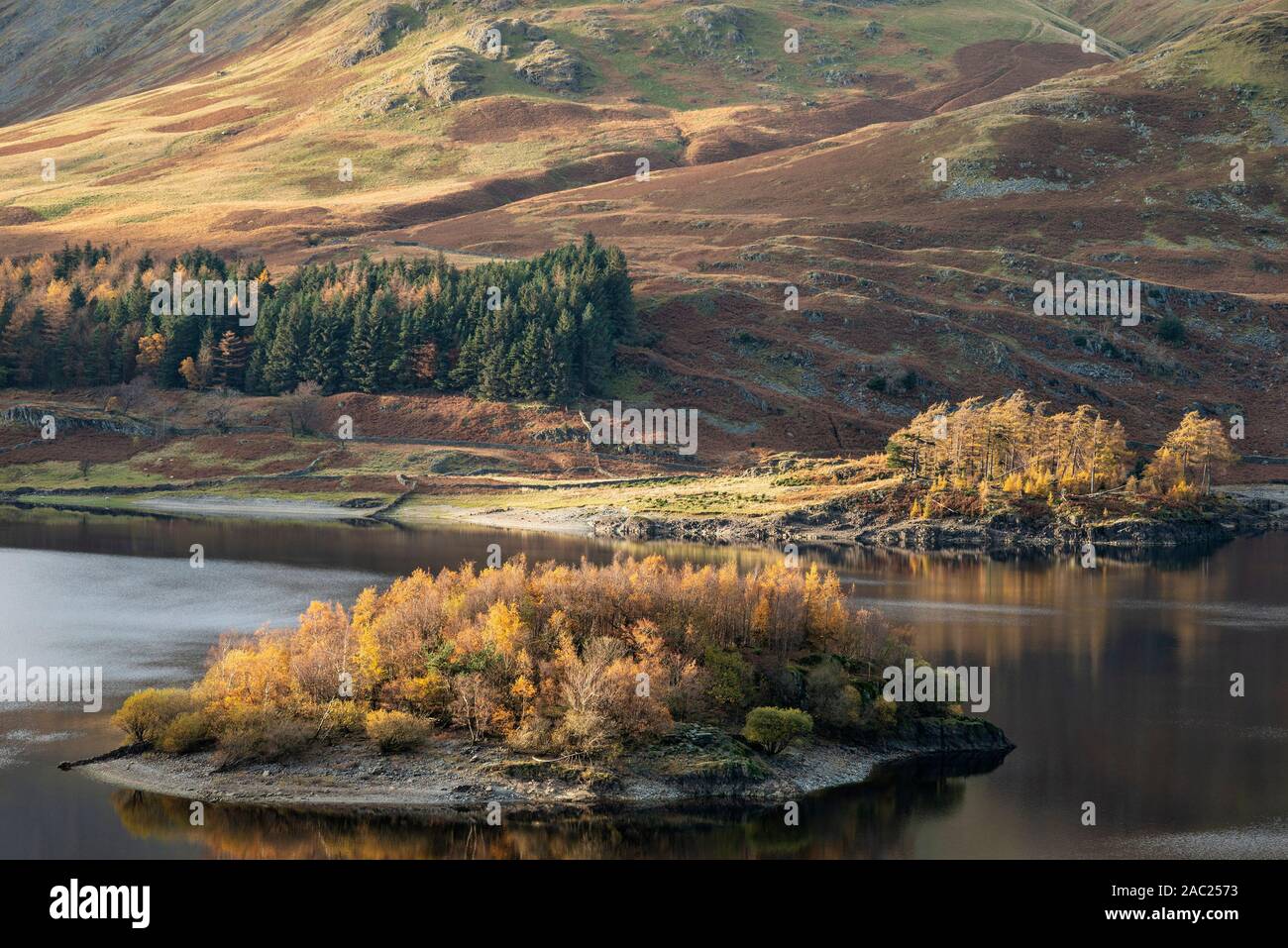 Epic Autumn Fall landscape of Hawes Water with epic lighting and ...