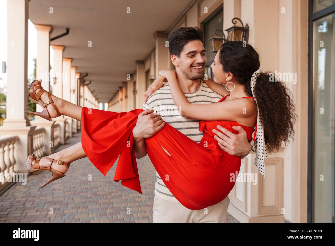 Romantic man carrying woman in hi-res stock photography and images - Alamy