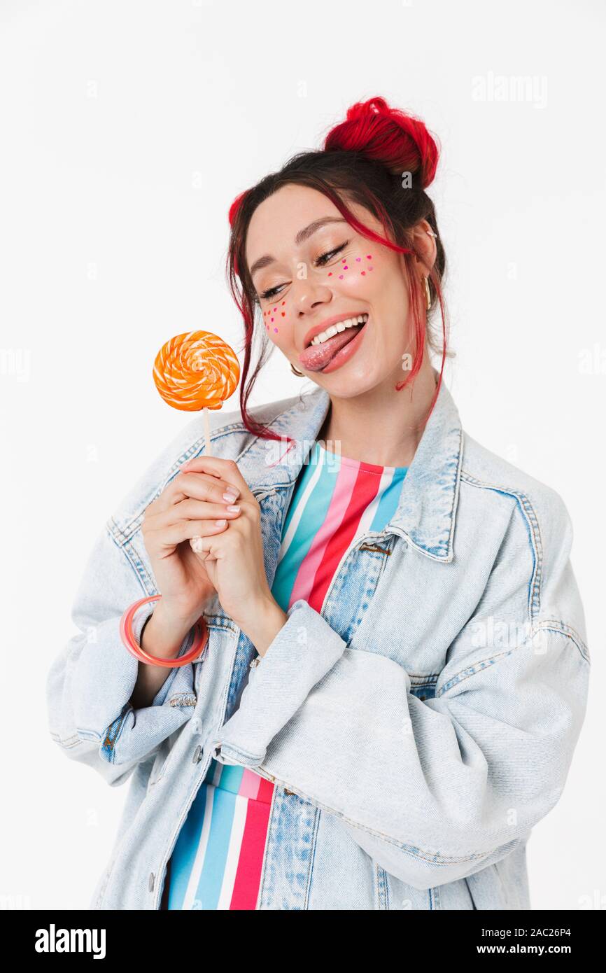 Image of funny caucasian woman with freckles holding and licking ...