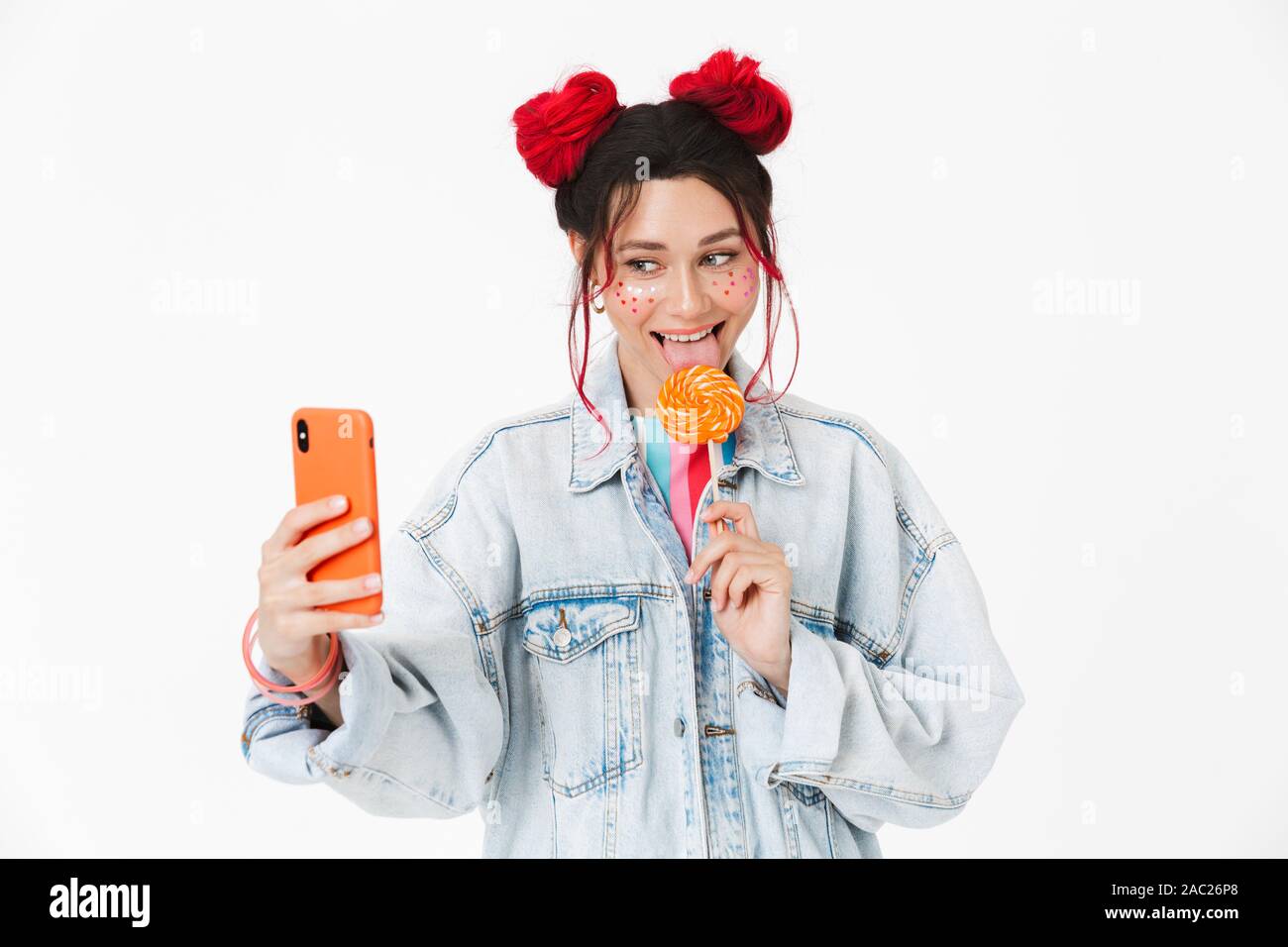 Image of amusing beautiful woman with freckles using cellphone and ...