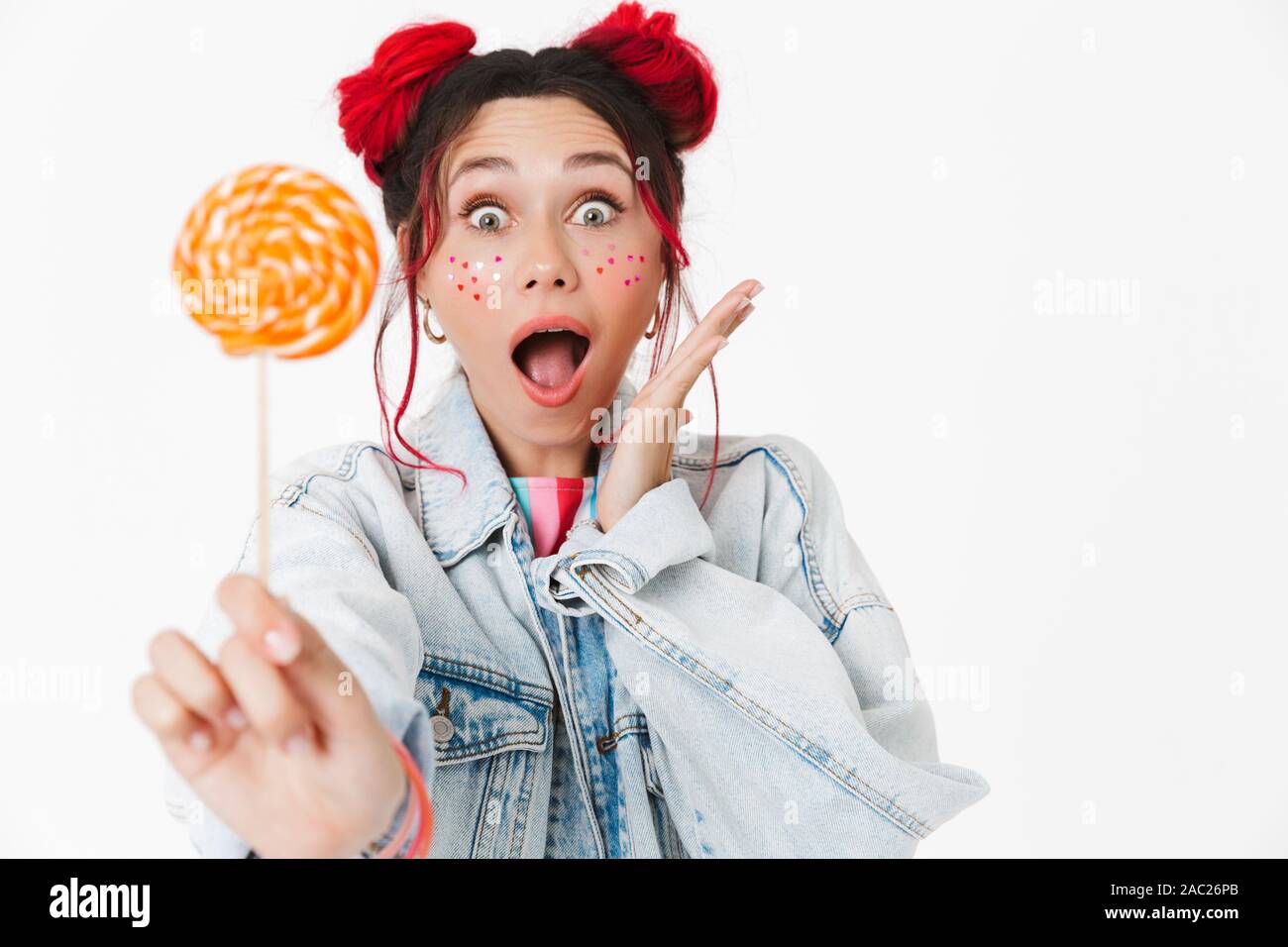 Image of delighted caucasian woman with freckles showing lollipop and ...