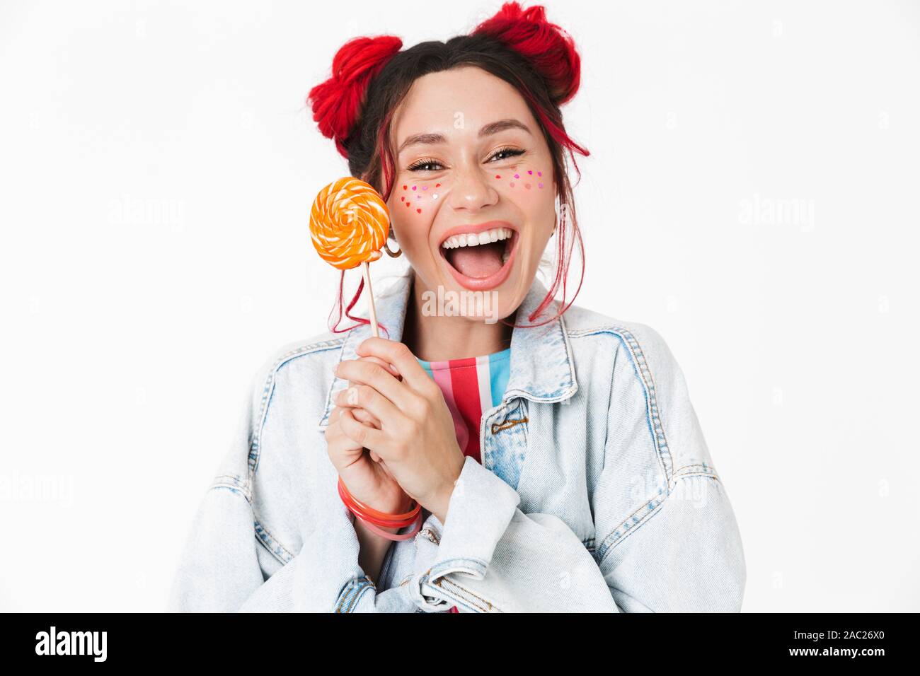 Image of laughing cute woman with freckles holding lollipop and looking ...