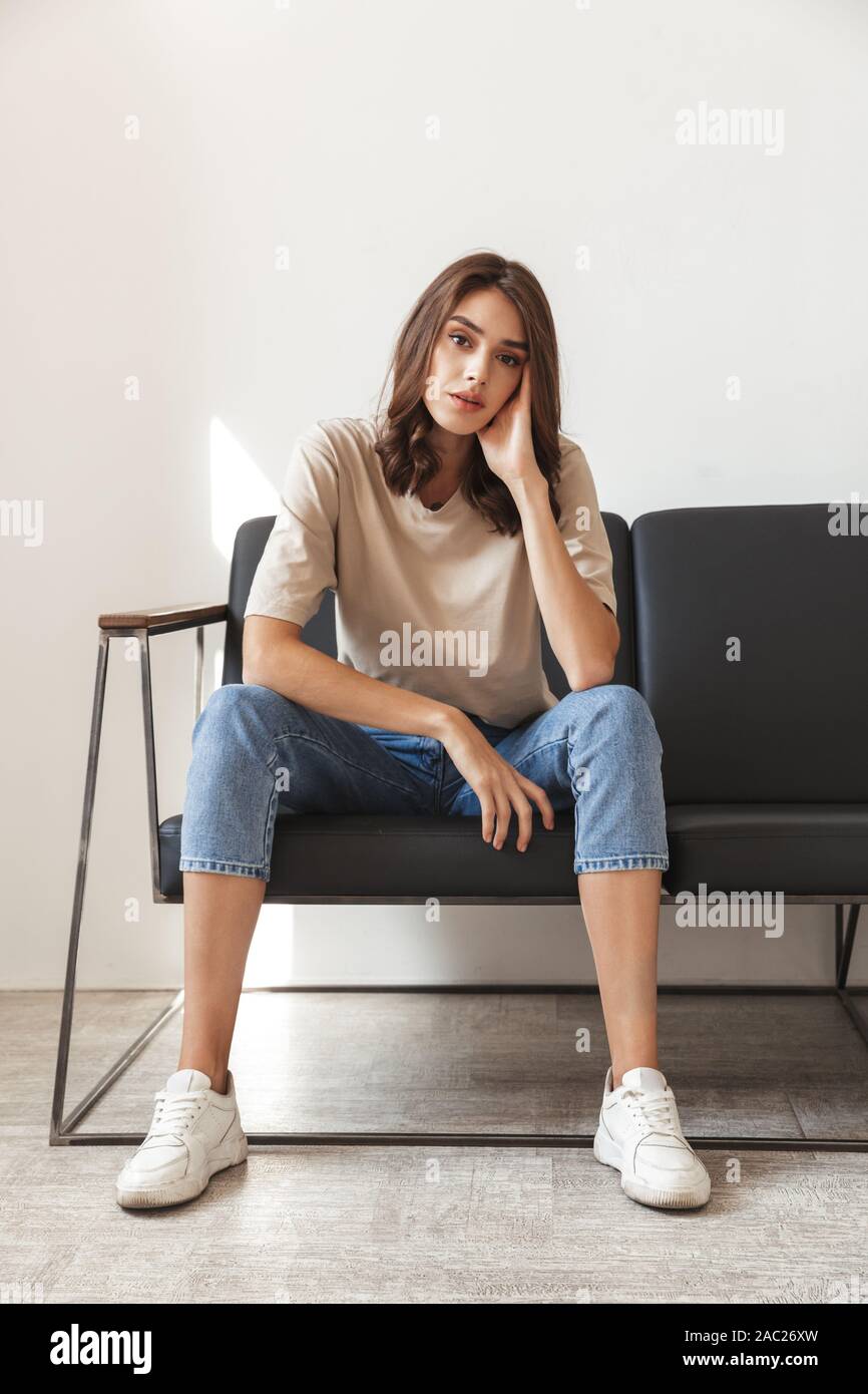 Image of concentrated pretty young amazing serious woman posing indoors ...