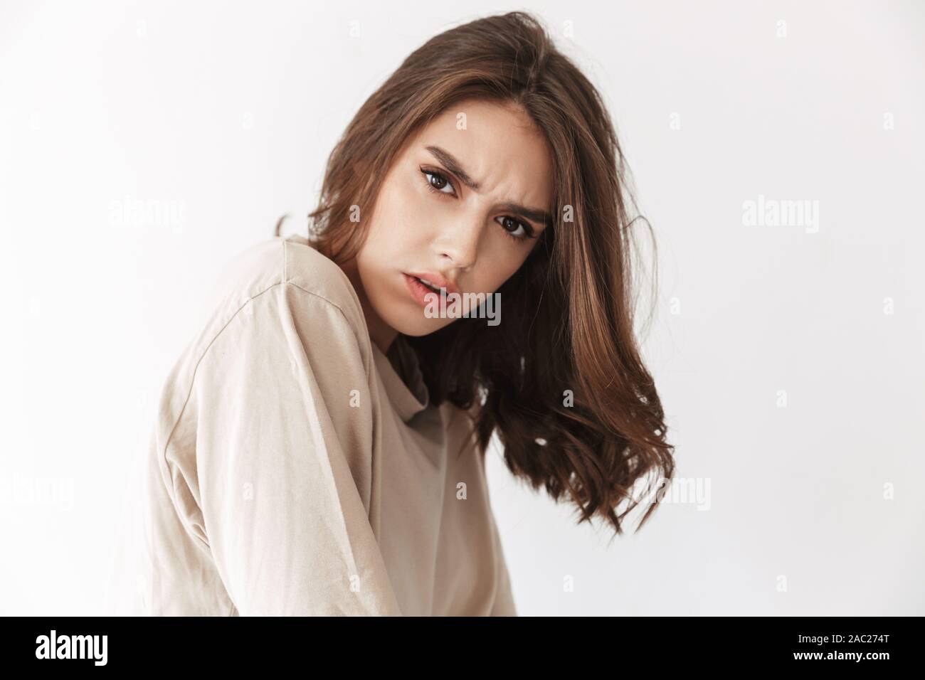 Photo of young displeased negative beautiful woman posing indoors ...