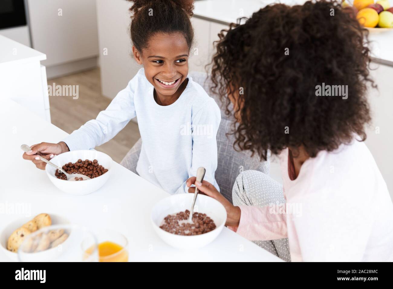 Image of african american woman and her little daughter having ...