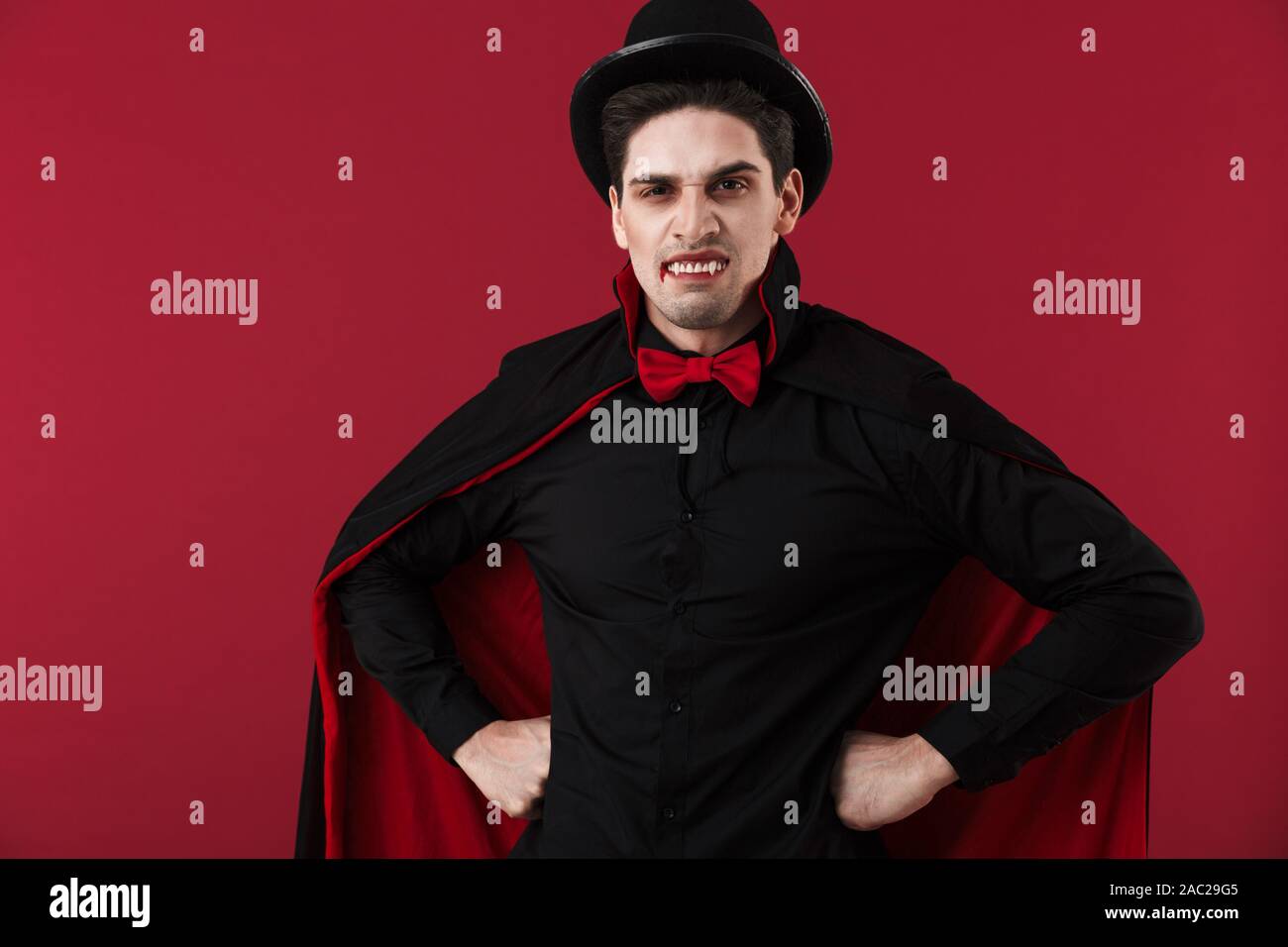 Image of frightening vampire man with blood and fangs in black ...
