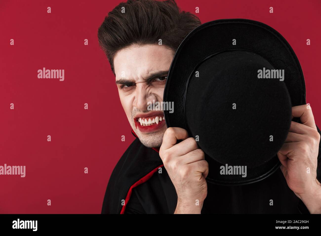 Image of scary vampire man with blood and fangs in black halloween ...