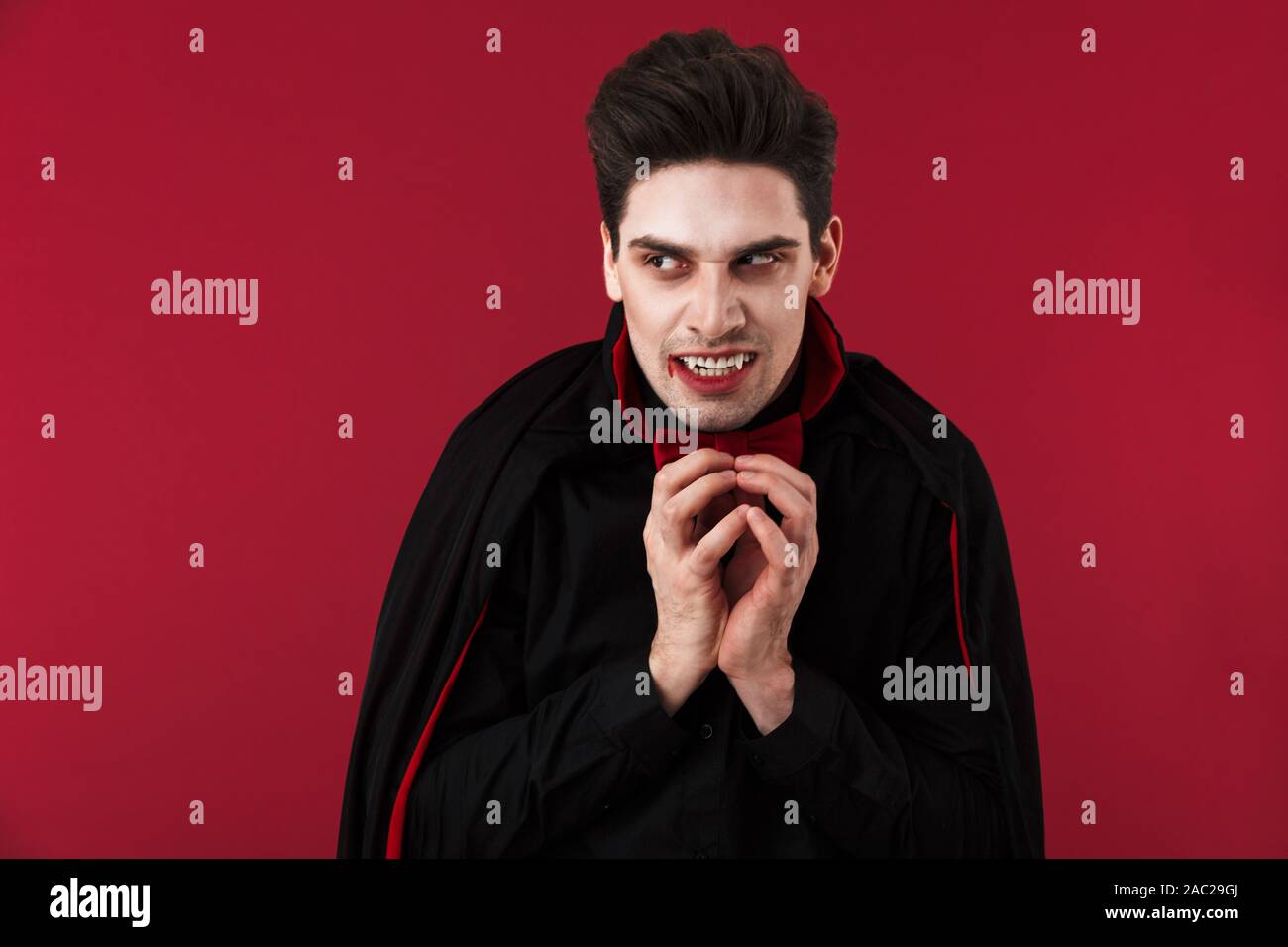 Image of crazy vampire man with blood and fangs in black halloween ...
