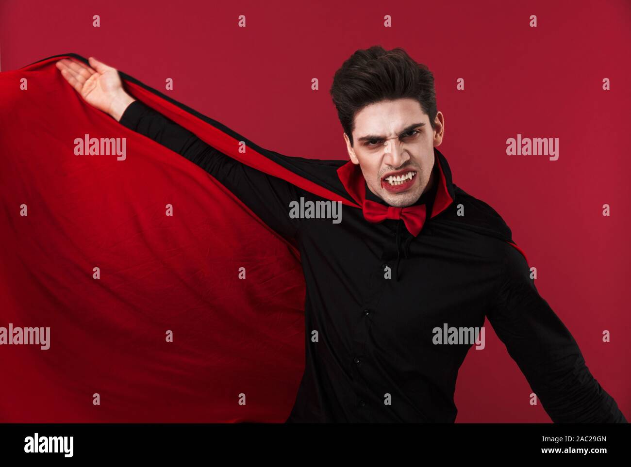 Image of scary vampire man with blood and fangs in black halloween ...
