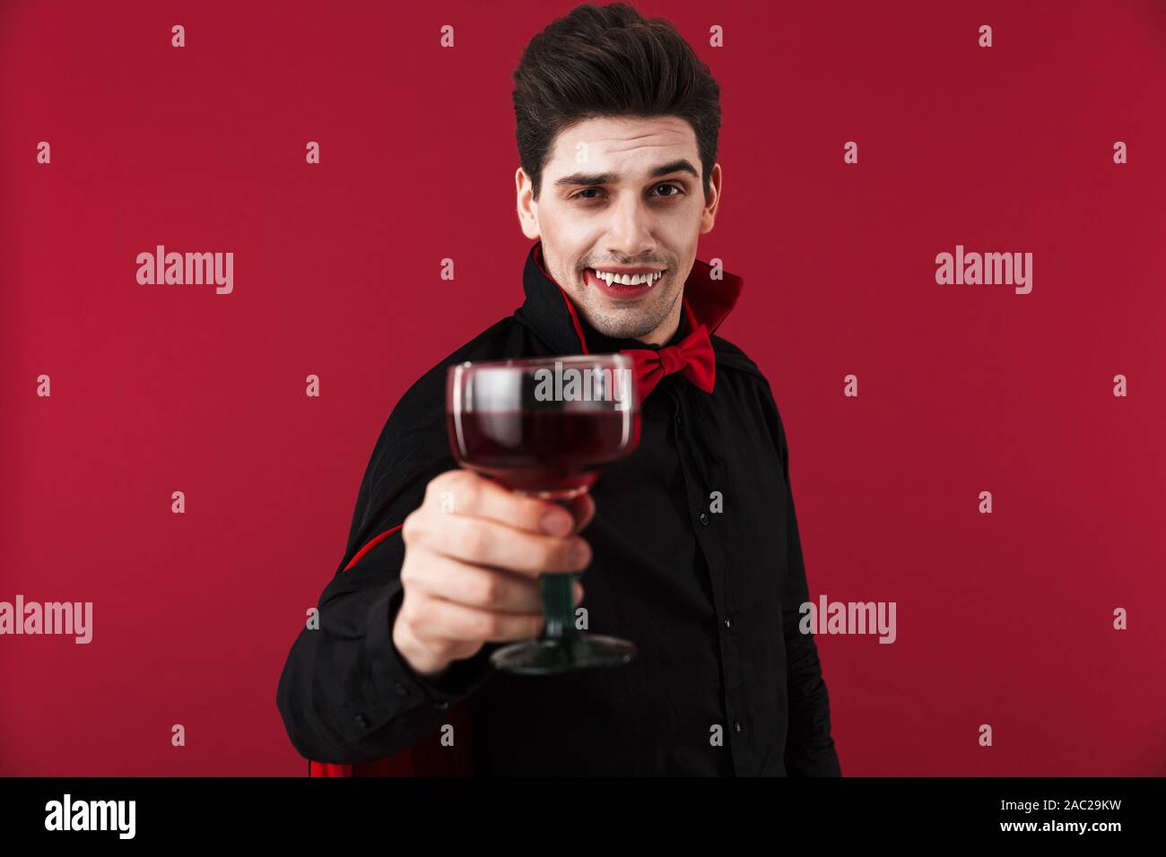 Image of happy vampire man with fangs in black halloween costume ...
