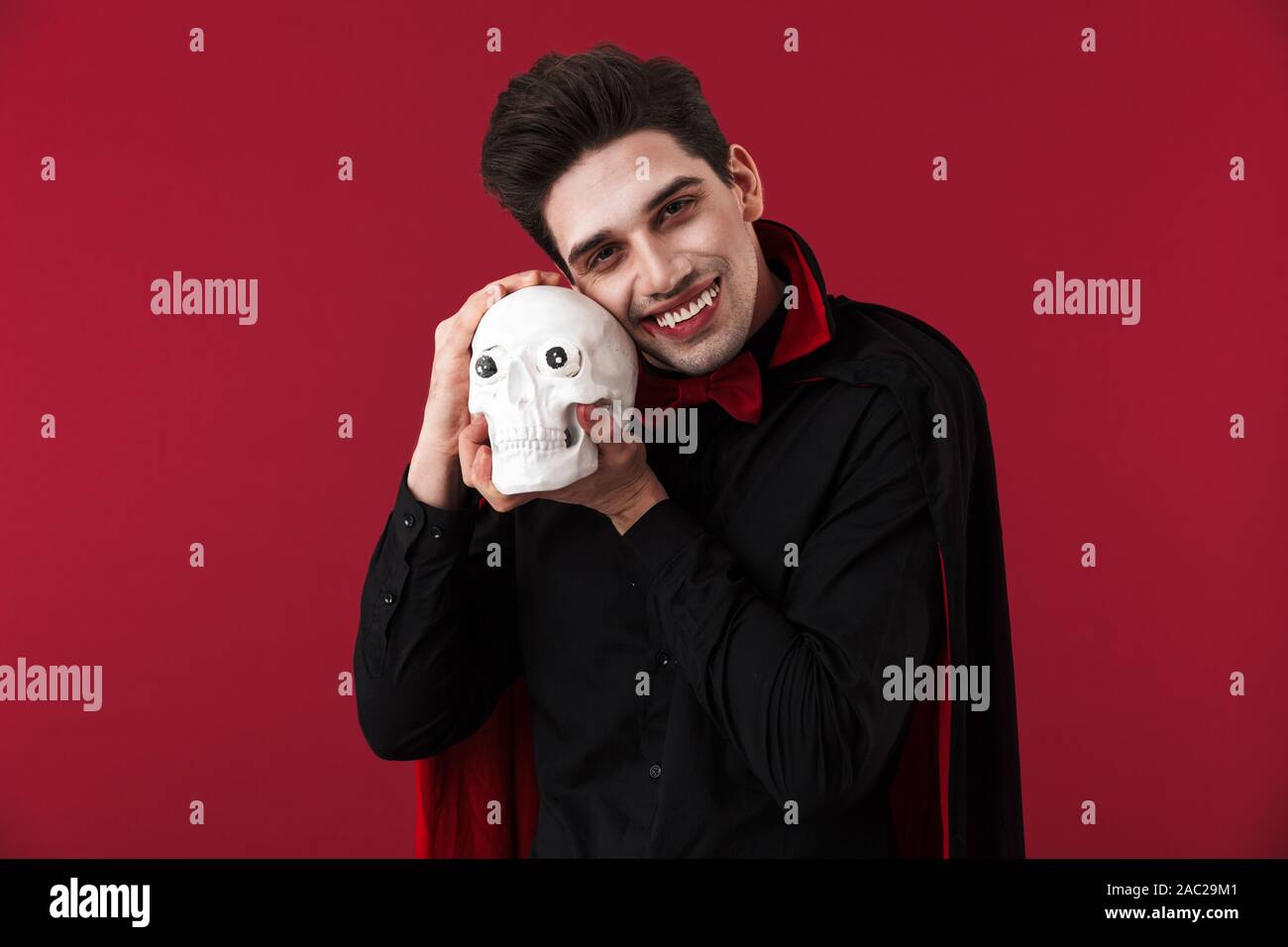 Image of happy vampire man with fangs in black halloween costume ...