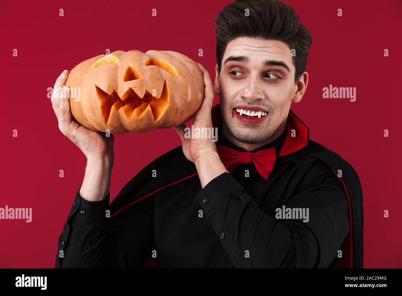 Image of mystic vampire man with fangs in black halloween costume ...