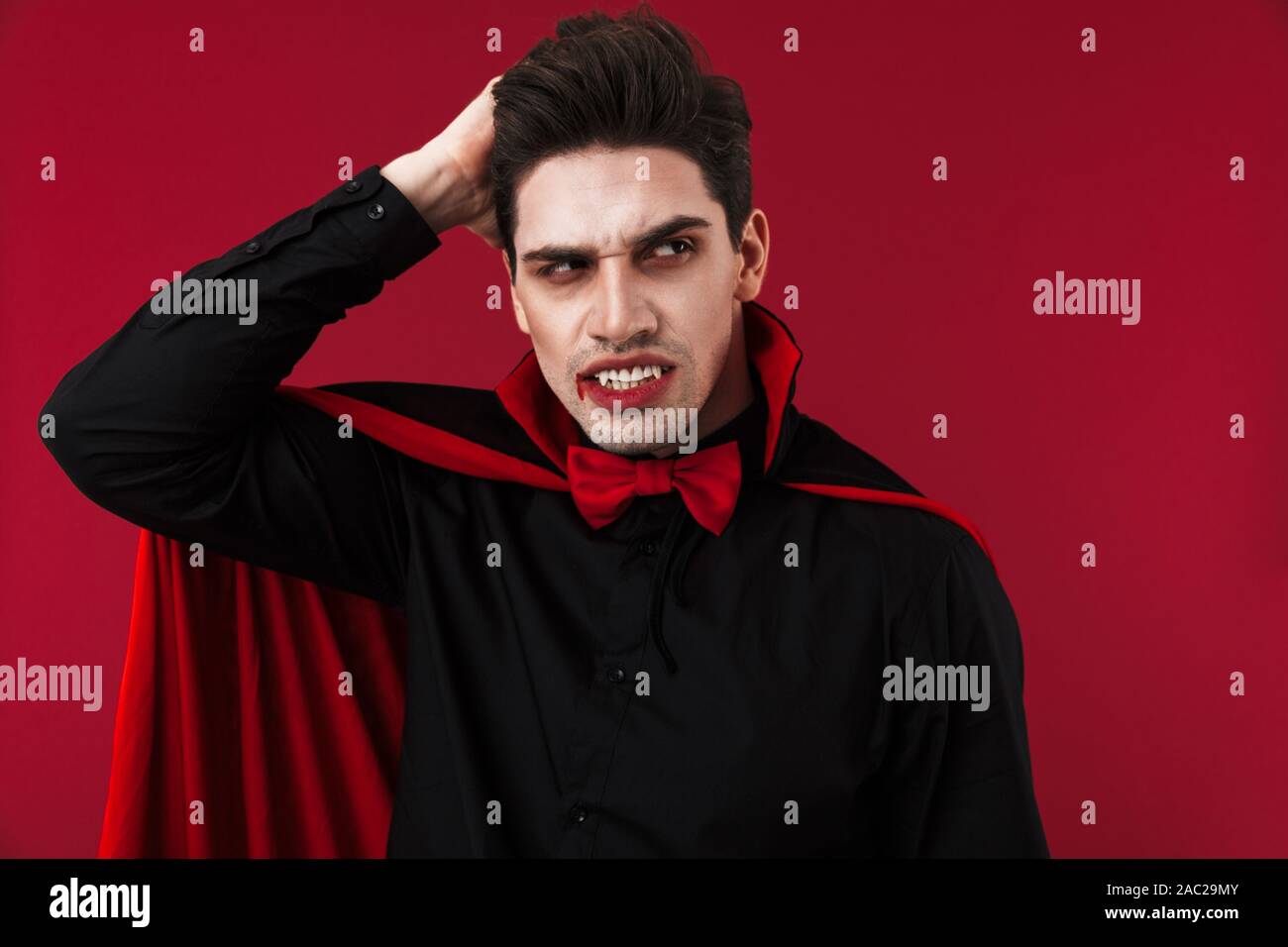 Image of angry vampire man with blood and fangs in black halloween ...