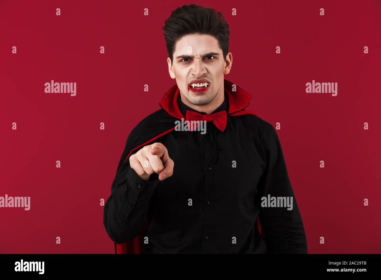 Image of angry vampire man with blood and fangs in black halloween ...