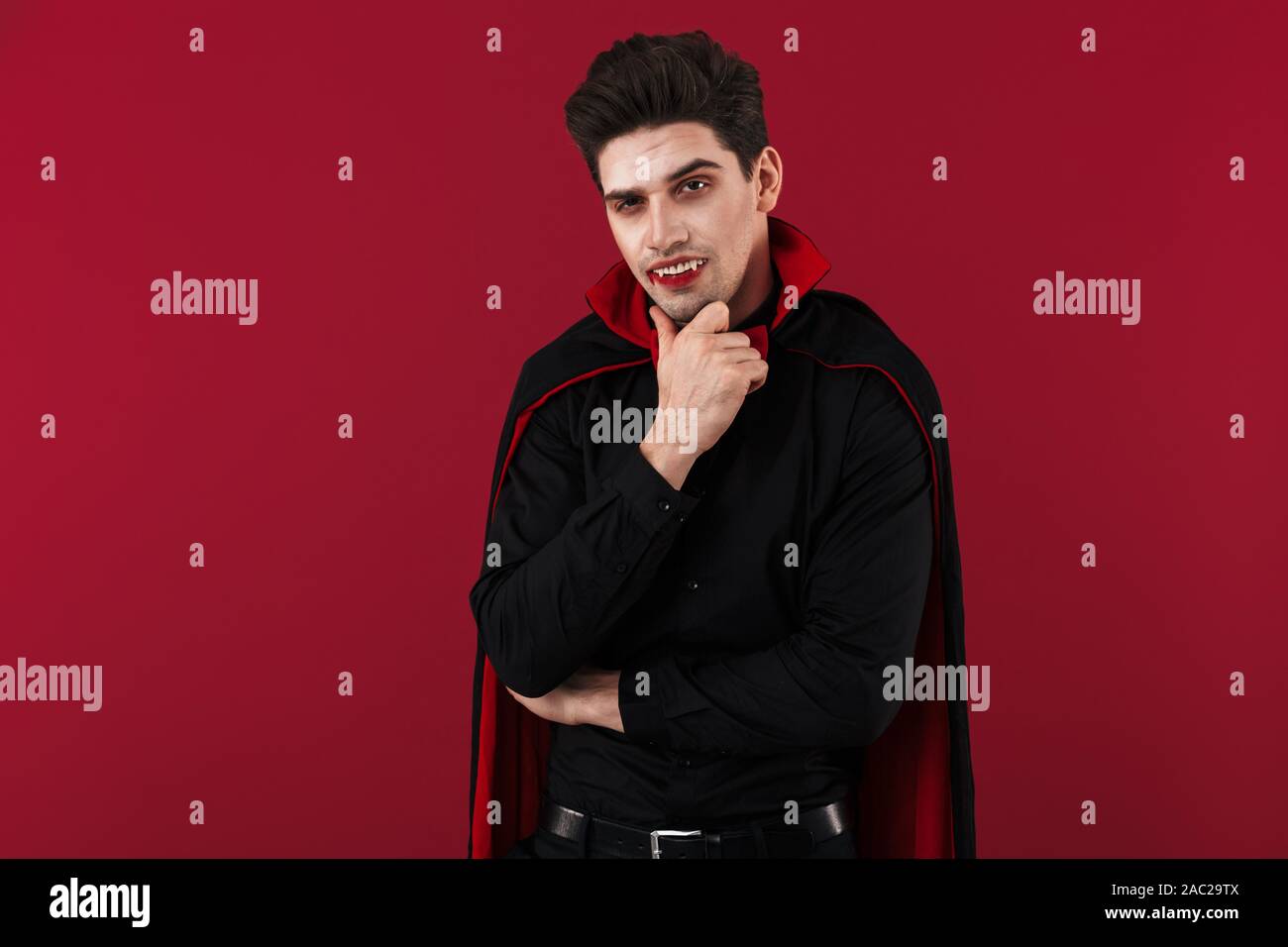 Image of masculine vampire man with blood and fangs in black halloween ...