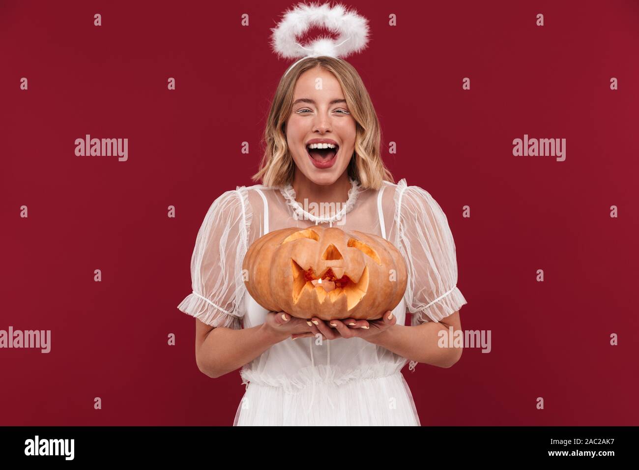 Photo of shocked screaming happy woman angel in carnival costume ...
